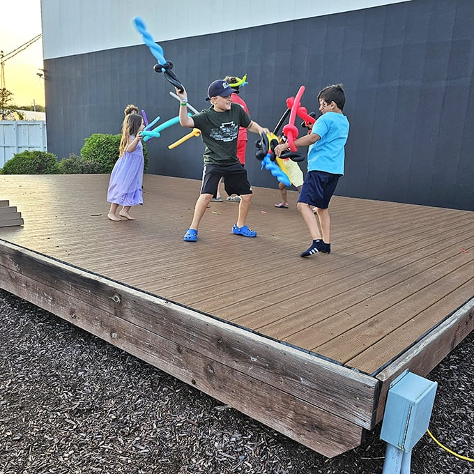 Young warriors engage in epic balloon sword battles on the stage before showtime &ndash; pre-movie entertainment that creates memories beyond the main feature.