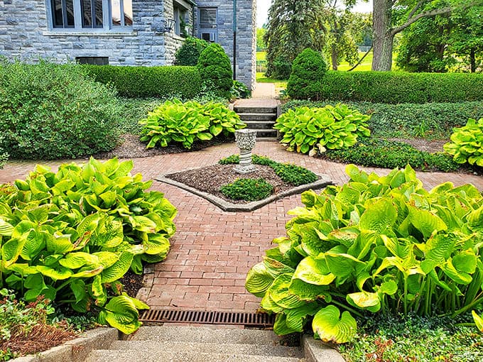 Nature and nurture meet in perfect harmony&mdash;flowering trees, manicured shrubs, and a garden bench that's witnessed countless moments of quiet contemplation.