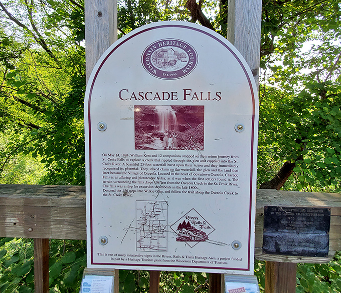 The informational sign reveals the falls' rich history, connecting today's visitors with those who discovered this treasure generations ago.