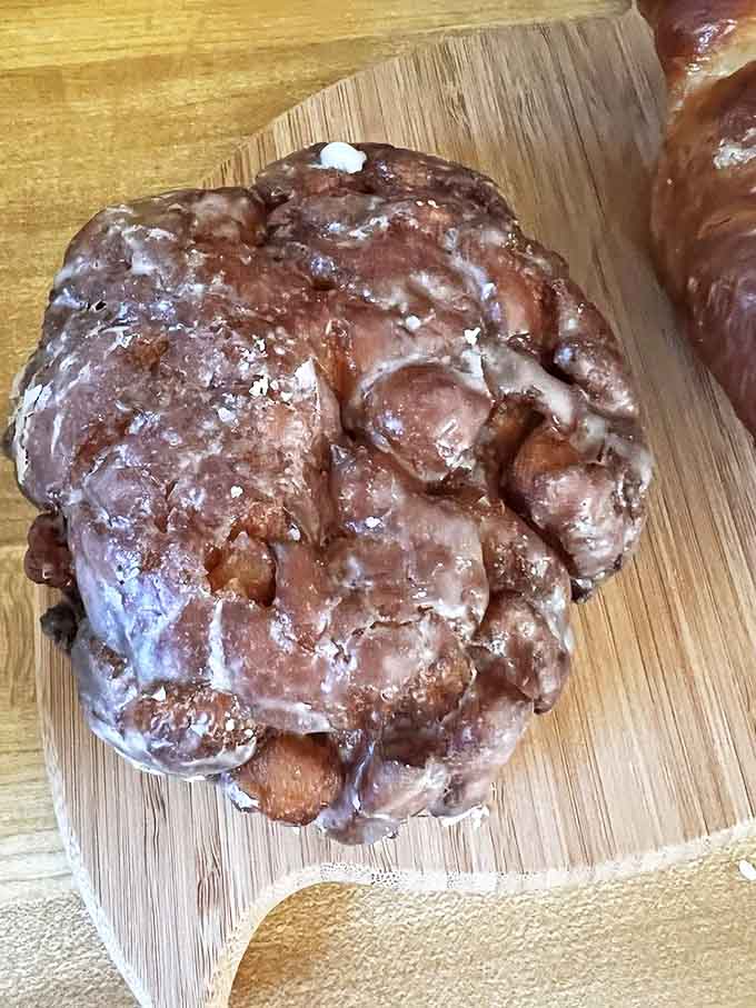 The apple fritter &ndash; nature's apples and human ingenuity collide in a caramelized landscape of morning happiness.