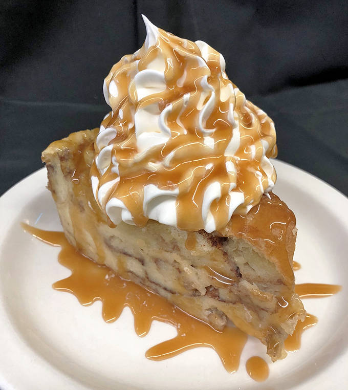 Banana cream pie crowned with whipped cream and caramel drizzle&mdash;the kind that makes you consider trading vital organs for the recipe.