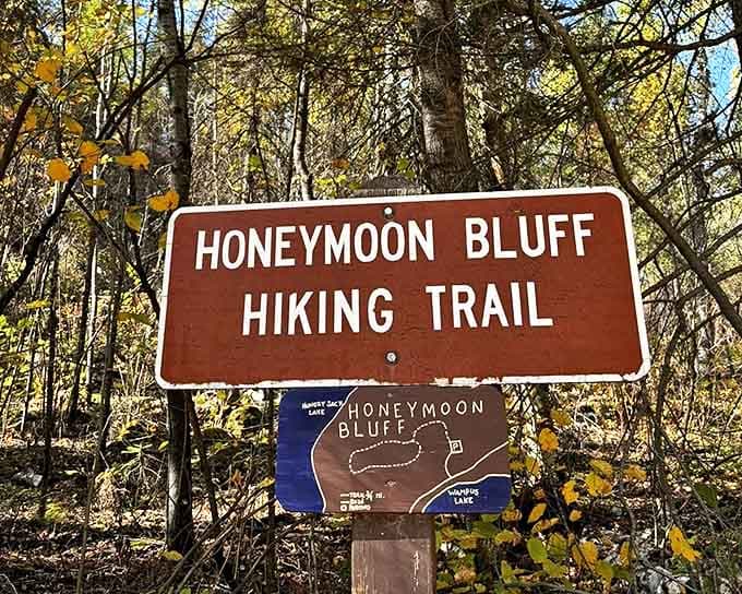 The trail sign stands sentinel, promising adventure without spoiling the surprise waiting at the summit. Best teaser trailer ever!