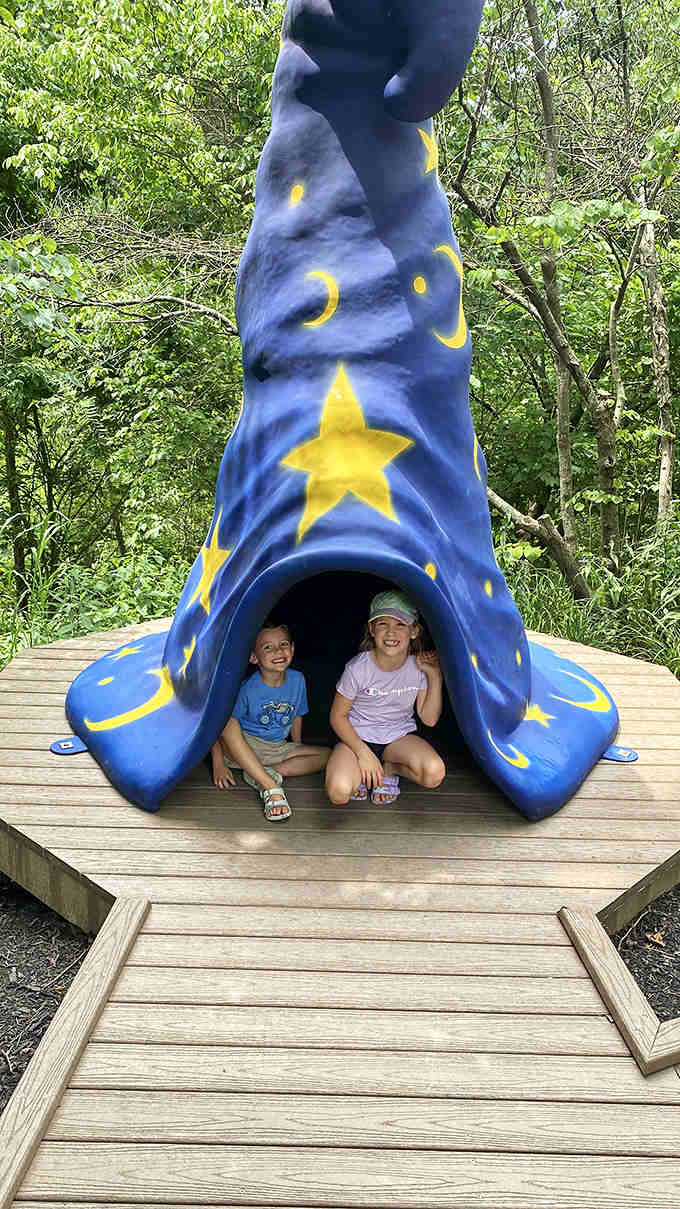 Stars and moons adorn this magical blue wizard hat structure where children can crawl inside and emerge with imaginary powers beyond their wildest dreams.