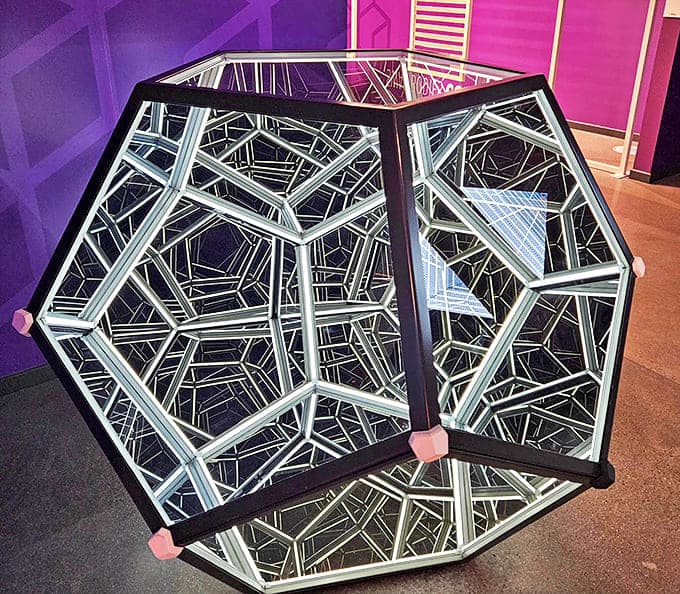 Step into the Infinity Dodecahedron and lose yourself in endless geometric reflections. It's like being inside the world's most beautiful diamond.