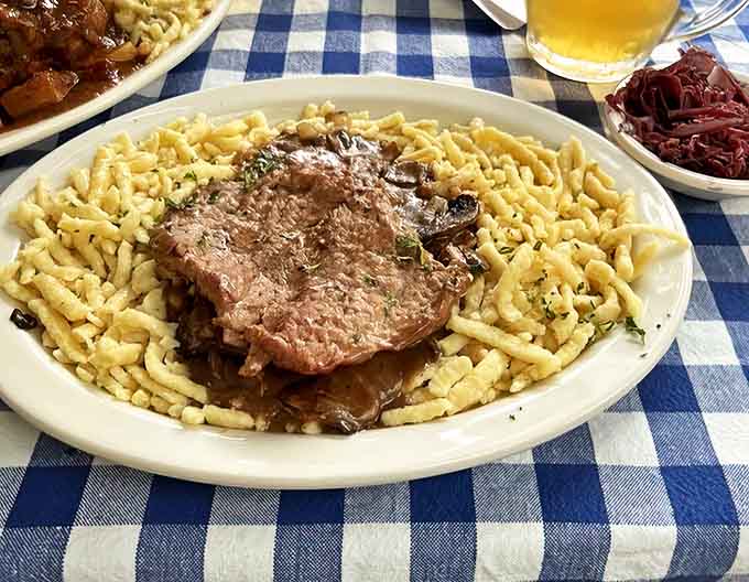 J&auml;gerschnitzel&mdash;where a perfectly fried cutlet meets its soulmate in a rich mushroom sauce, all nestled beside sp&auml;tzle ready to soak up every drop.