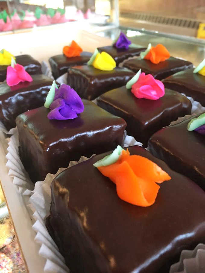 Tiny chocolate squares topped with delicate frosting flowers &ndash; the kind of treat that makes you feel fancy even while wearing sweatpants.