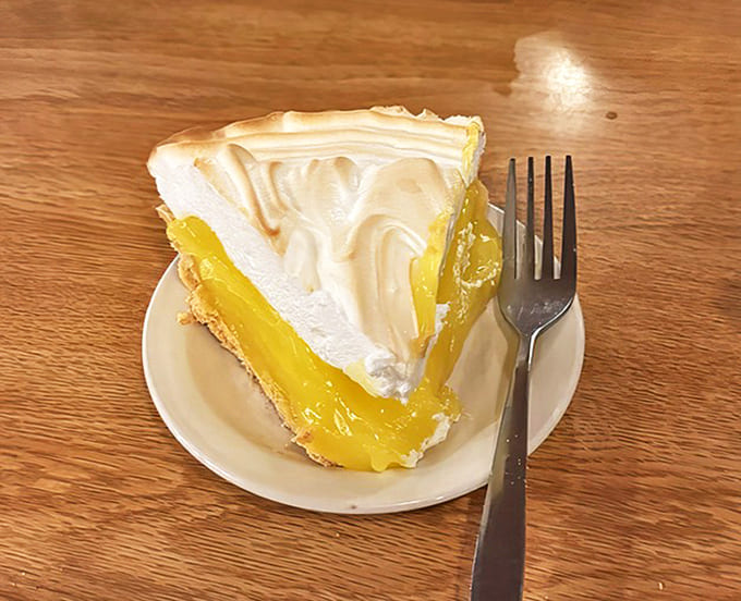 Mile-high lemon meringue pie with perfectly browned peaks atop bright, tangy filling &ndash; a sweet finale worth saving room for.