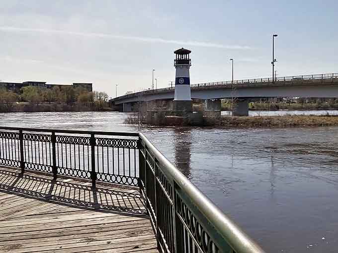 The boardwalk's gentle curve leads visitors toward the lighthouse, creating a journey as rewarding as the destination itself.