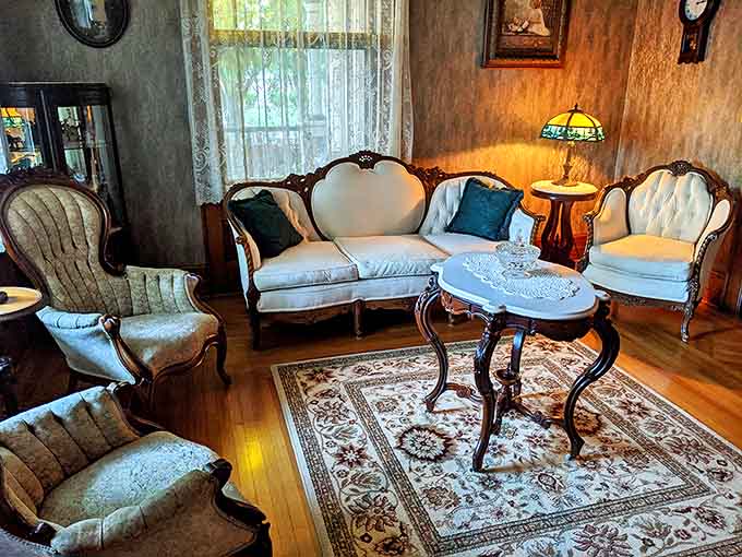 Living Room: Elegant period furniture creates a parlor where you'll automatically sit up straighter while secretly plotting to steal decorating ideas.