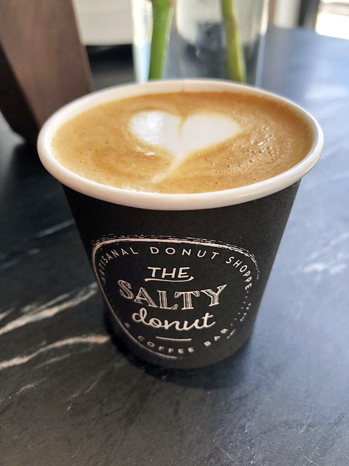 Even the coffee gets the artisanal treatment &ndash; this heart-topped macchiato proves The Salty Donut takes their liquid offerings as seriously as their pastries.