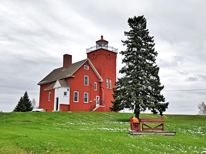 The day transforms the lighthouse into a haven, where the contrast of red brick against white sky creates postcard-perfect scenes.
