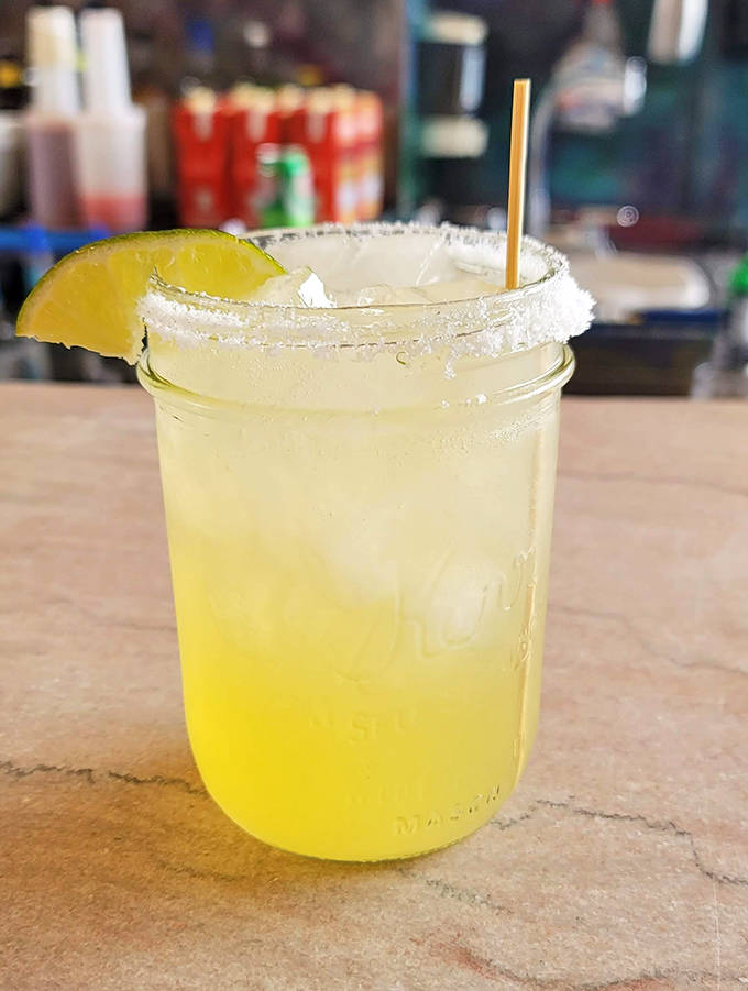 A perfectly salted rim frames this sunshine-yellow margarita, promising a taste of summer regardless of Lake Superior's weather moods.