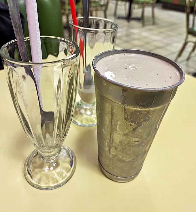 Classic milkshakes served in vintage glasses – thick enough to require serious straw strength but worth the effort.