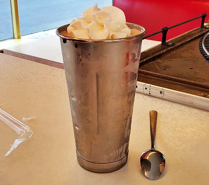 This isn't just a milkshake; it's a silver chalice of creamy indulgence that demands both a straw and a spoon.