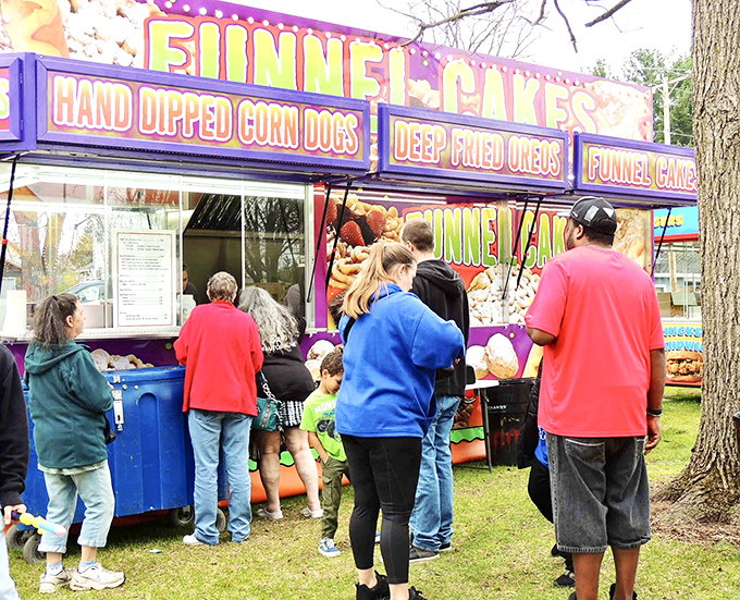 The Fish-n-Fun Festival's funnel cake stand creates a line that's absolutely worth waiting in, proving fried dough transcends all age groups.