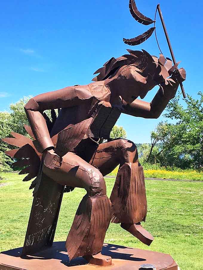 This striking metal sculpture honors the region's indigenous heritage, standing as a powerful counterpoint to Paul's folkloric presence.