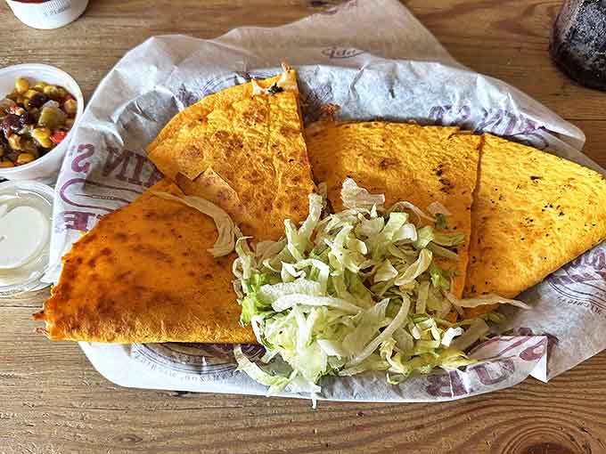 Crispy tortilla triangles hiding a molten cheese treasure, served with the kind of slaw that makes you rethink coleslaw's potential.
