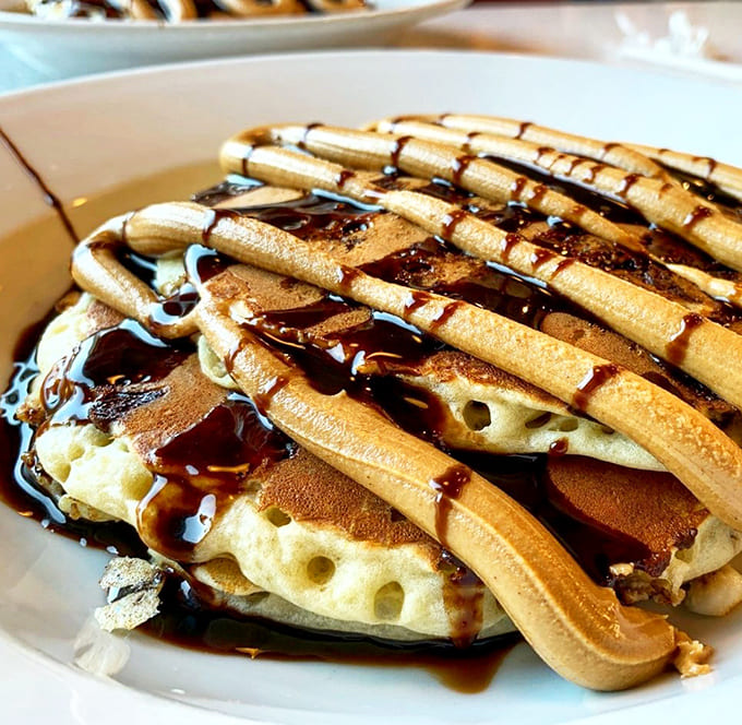 Pancakes drizzled with chocolate sauce and butter &ndash; proof that sometimes the simplest pleasures are the most satisfying ones.