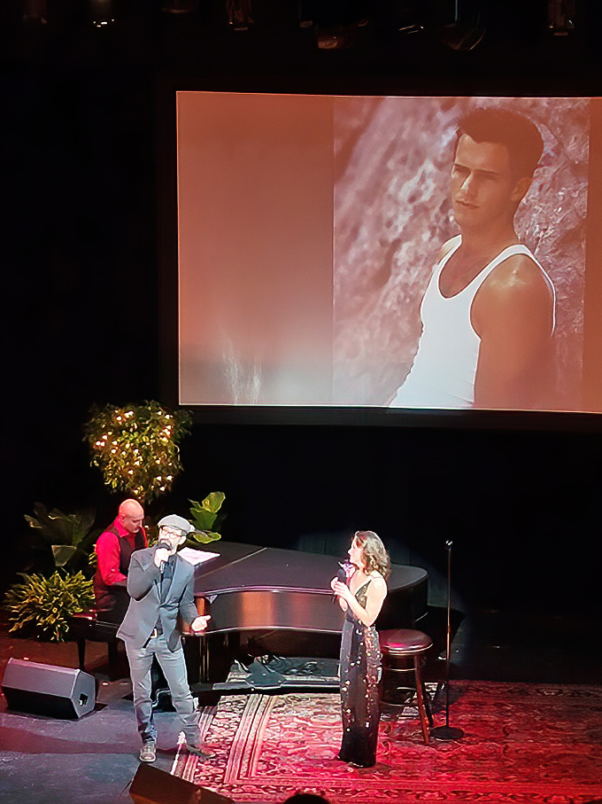 Performers take the stage beneath the grand proscenium arch, their talents amplified by the theater's perfect acoustics and intimate atmosphere.
