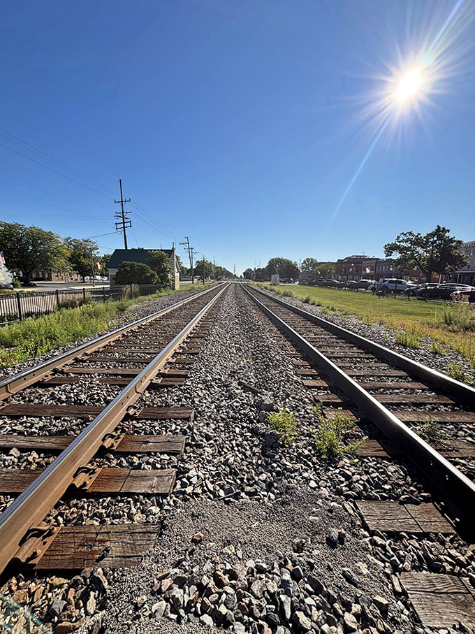 Railway tracks stretch toward the horizon, reminding visitors that Sandwich once thrived as a transportation hub connecting past to present.