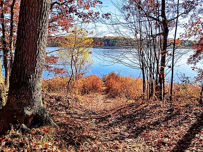 Fall's fiery palette reflected in still waters &ndash; Mother Nature showing off her seasonal wardrobe change with spectacular flair.
