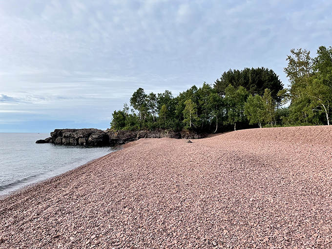The beach's signature pink stones stretch as far as the eye can see, creating a landscape that feels delightfully alien.