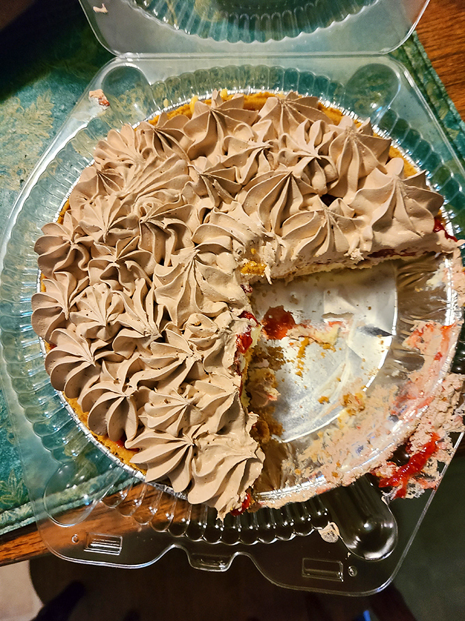 One bite of this chocolate-topped raspberry cheesecake and you'll understand why people drive for hours just for Mama Jo's creations.