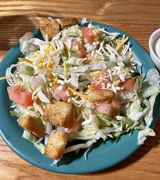 A fresh garden salad topped with shredded cheese, diced tomatoes and crunchy croutons offers a lighter option before diving into heartier fare.