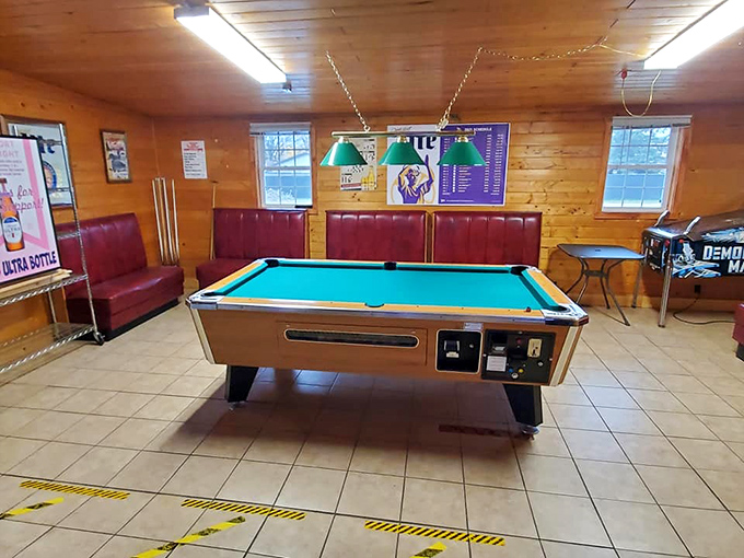 The well-worn pool table stands ready for the next challenger &ndash; its felt surface having witnessed countless friendly competitions.