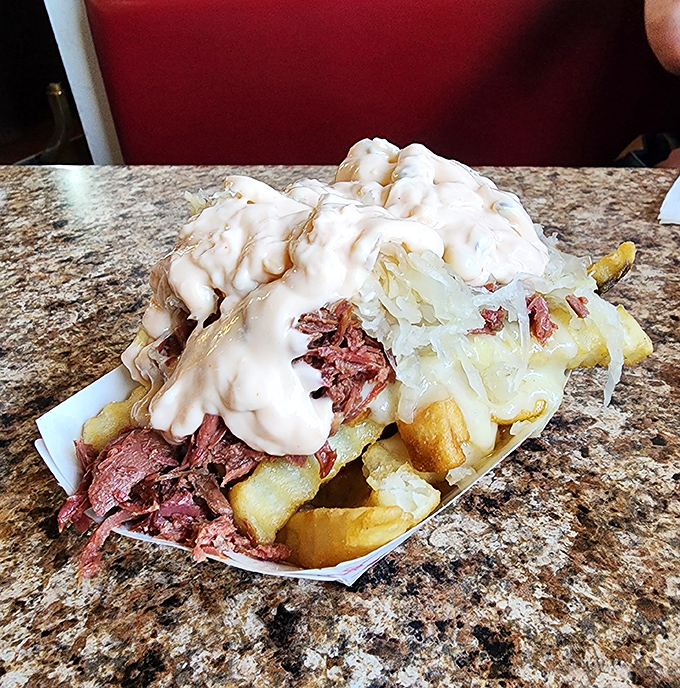 Loaded fries that laugh in the face of moderation &ndash; a mountain of potatoes, meat, and cheese that requires a fork and commitment.