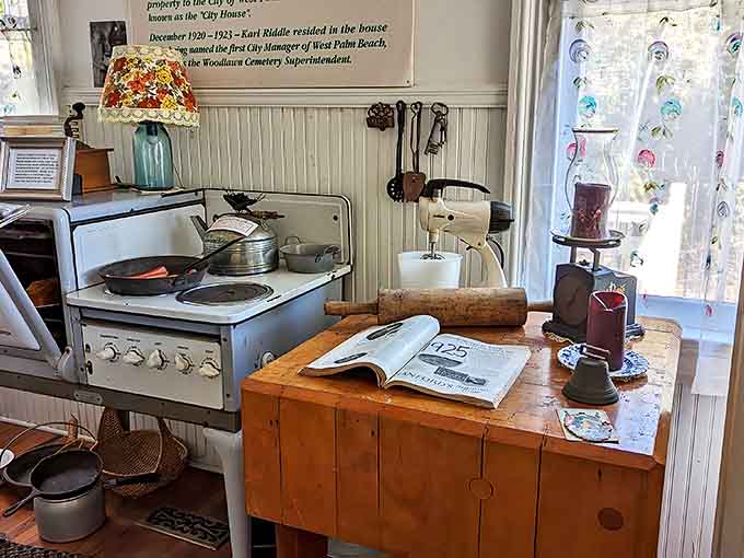 The kitchen's vintage stove and preparation table showcase the labor-intensive domestic life of early 20th century Florida.