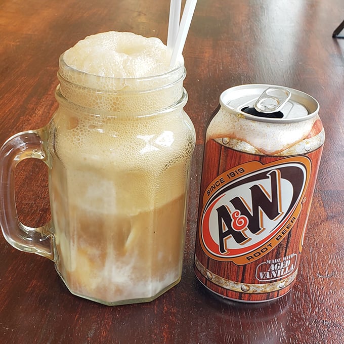 An old-fashioned root beer float served in a mason jar mug &ndash; childhood nostalgia in liquid form with a side of A&W.