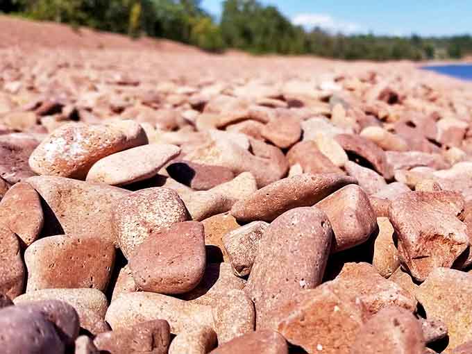 Up close, the smooth, rounded cobblestones reveal subtle variations in color and texture &ndash; each one a tiny geological masterpiece.