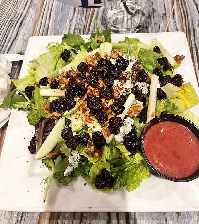 Even salads get the tropical treatment, with this apple and dried cherry creation offering a refreshing counterpoint to the menu's heartier offerings.