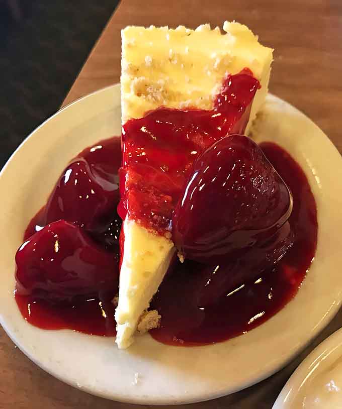 That cheesecake topped with glossy strawberries is the reason you should always, always save room for dessert, no matter how full you think you are.