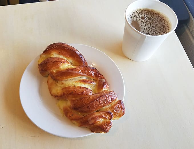 Morning perfection: a twisted cardamom bread alongside coffee so good you'll contemplate moving to the neighborhood.