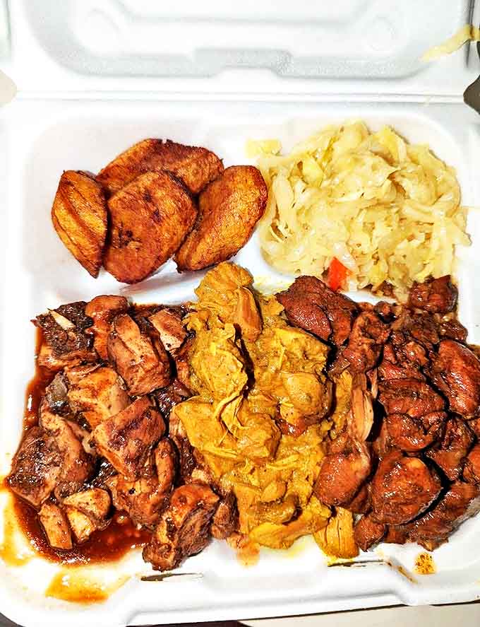 The triple delight platter offers a tour of Jamaica's greatest hits &ndash; jerk chicken, curry, and cabbage slaw create a symphony of complementary flavors.