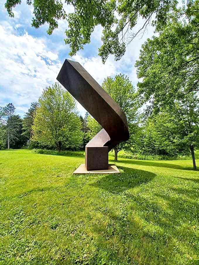 This twisted metal column reaches toward the sky with elegant determination, its curves reminiscent of a dancer mid-pirouette.