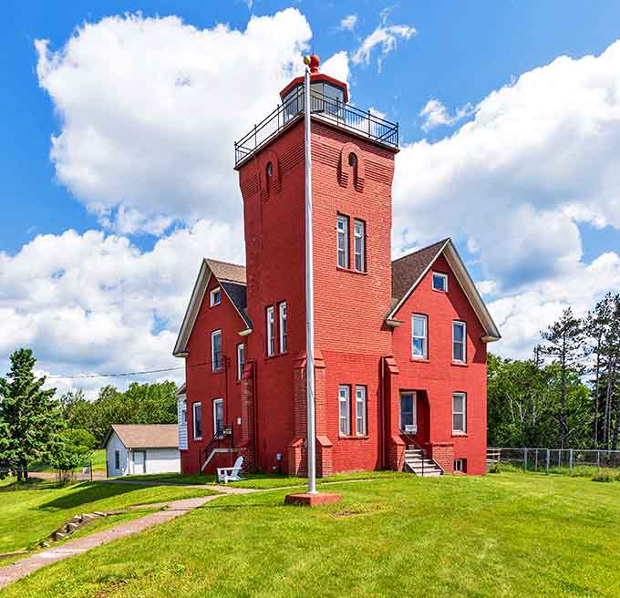Two Harbors Lighthouse has guided ships safely to shore since 1892, its bright red exterior standing out like nature's own exclamation point.