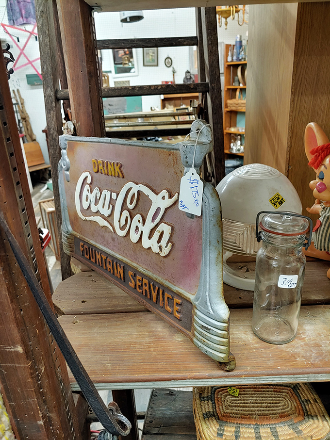 A vintage Coca-Cola fountain service sign that once directed thirsty customers now directs collectors to memories of soda jerks past.