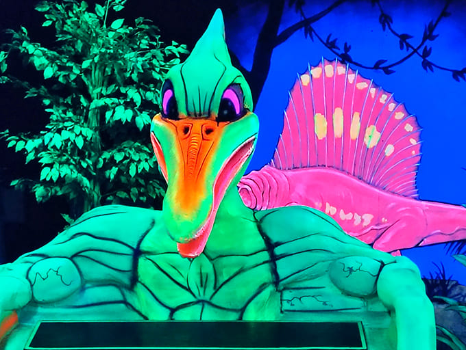 Electric blue leopards lounge on neon branches, creating a surreal safari experience where wildlife watching comes with a side of putting.