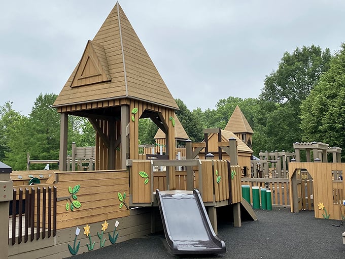 Wildwood Park's wooden castle playground invites children to rule their own magical kingdom while parents enjoy a moment of peace on nearby benches.