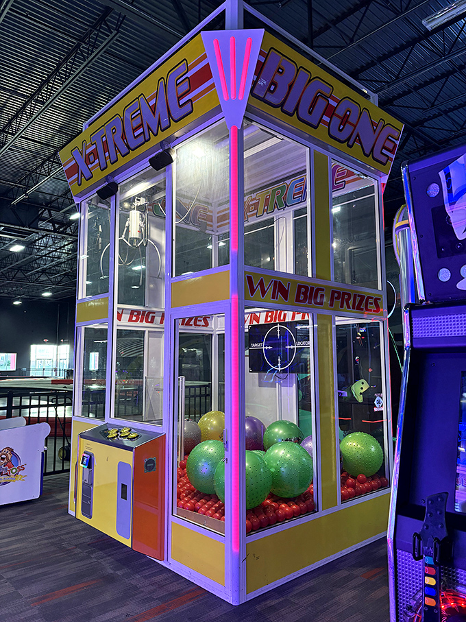 The X-treme Big One claw machine towers over the arcade area, its neon lights and oversized prizes tempting visitors to test their skill and luck.