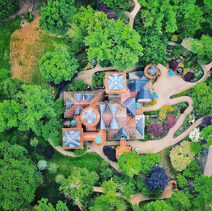 From above, the castle's intricate design reveals itself like an architectural jigsaw puzzle nestled perfectly into the landscape.