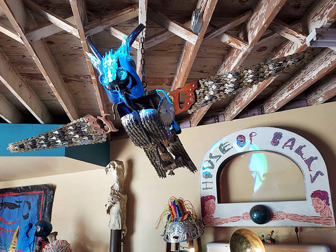 This sculpture reaches skyward, its delicate framework creating a powerful silhouette against nature's own artwork.