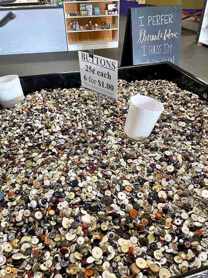 The button bin &ndash; where crafters become treasure hunters, sifting through history one small disk at a time.