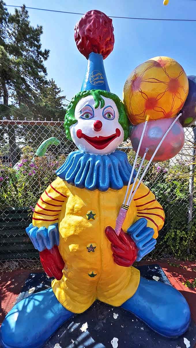 This vintage clown statue holds his balloons with eternal cheer, delighting children and slightly unnerving adults who've watched too many horror movies.