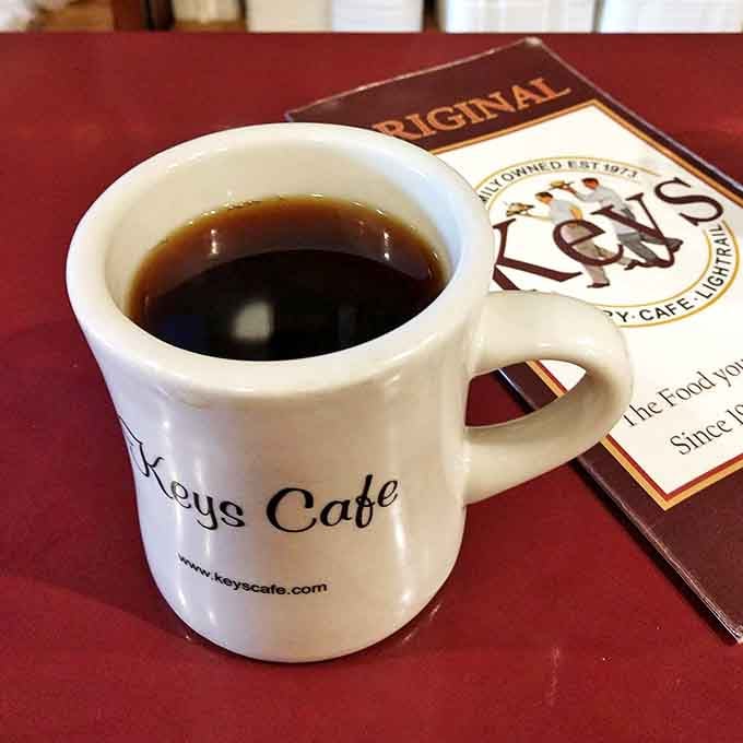 Warm up with a fresh cup of coffee at Keys Cafe, where friendly service and a cozy atmosphere await you.