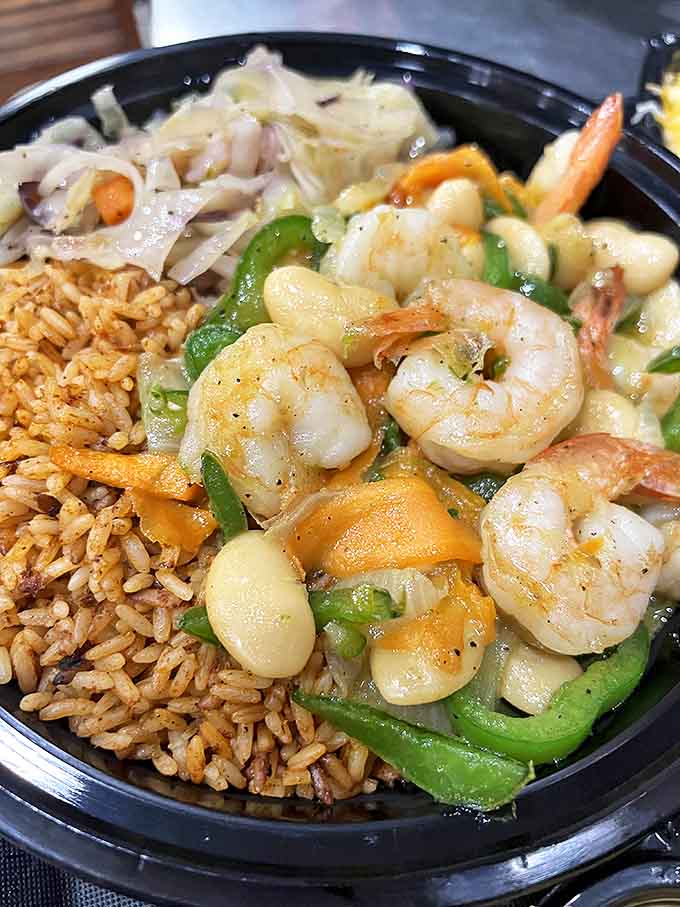 Plump shrimp swimming in curry sauce alongside crisp vegetables and rice &ndash; like a tropical vacation that fits on a fork.