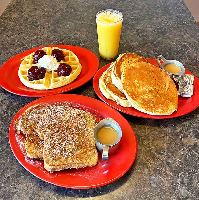 Breakfast perfection awaits with golden pancakes, crisp waffles topped with berries, and French toast that puts boring bread to shame.